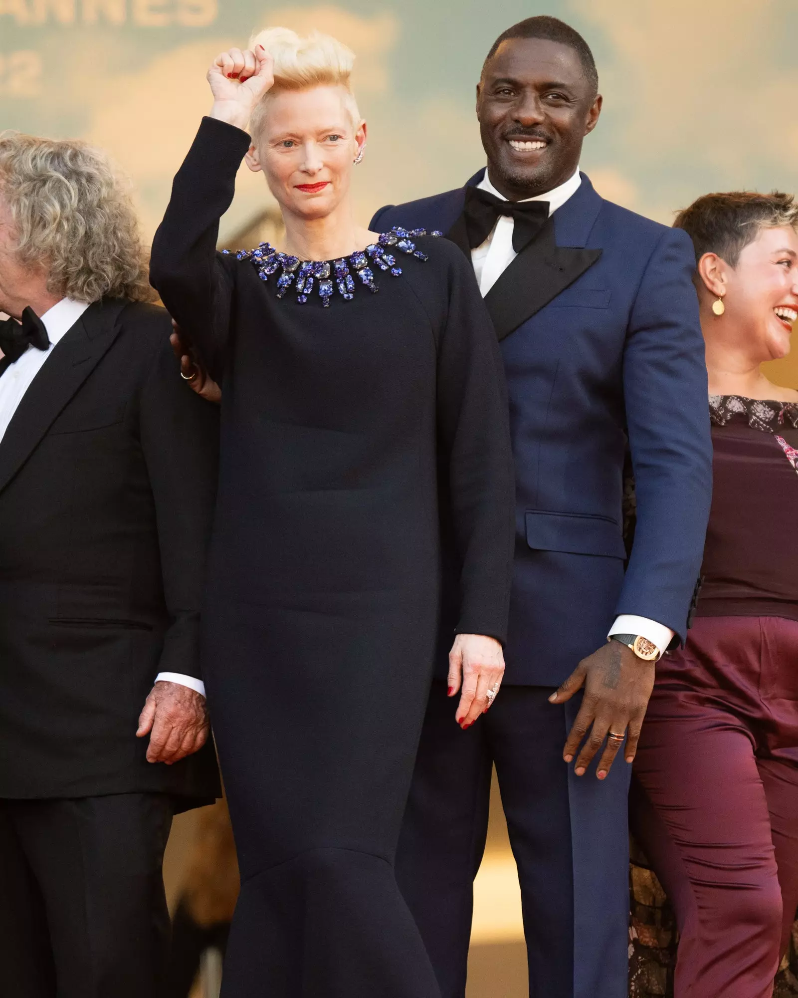 Image mai contain Tilda Swinton Idris Elba Human Person Fashion Premiere Suit Coat Clothing Overcoat and Apparel