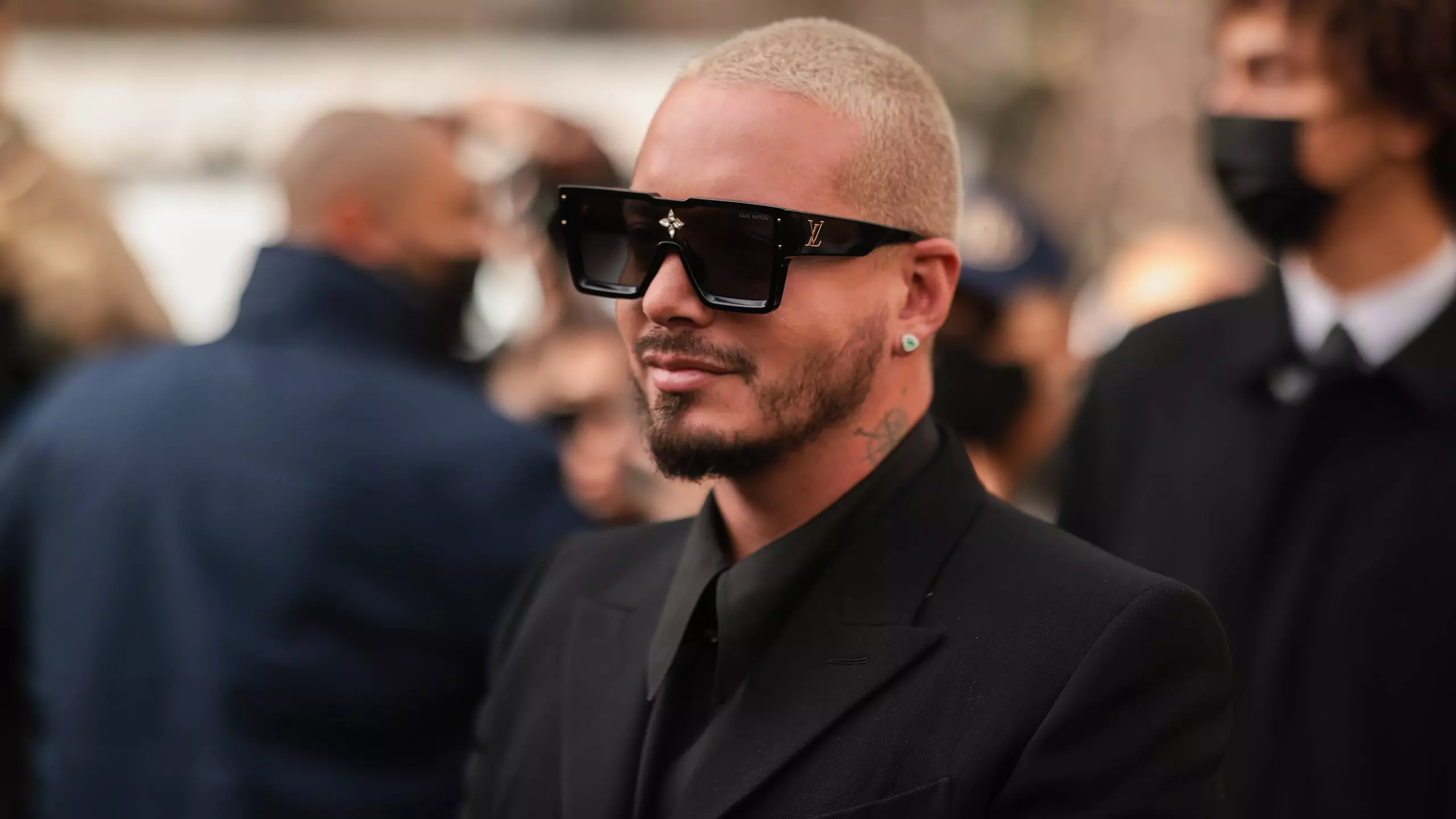 J Balvin at the entrance of the Louis Vuitton fall winter 2022 2023 fashion show.