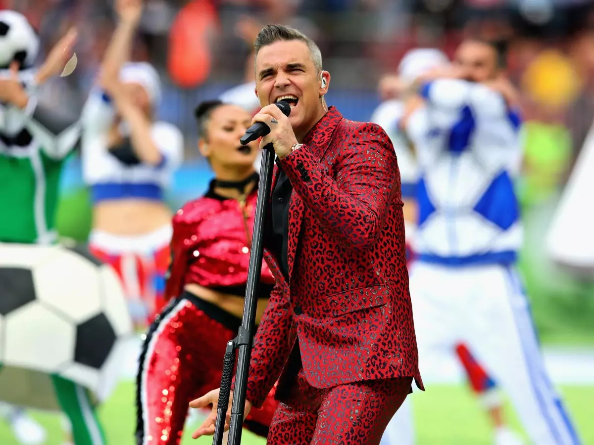 Dak kollu li trid tkun taf qabel ma tiġġenn b'Robbie Williams għall-moxt tiegħu fit-Tazza tad-Dinja